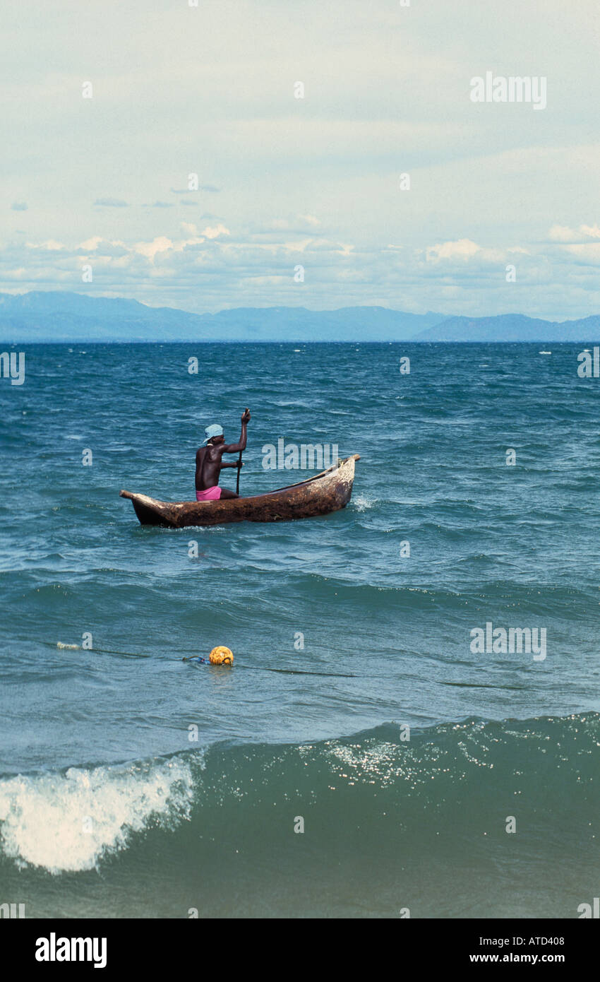 Man in a canoe in the Rift Valley Lake Malawi, Malawi Stock Photo - Alamy