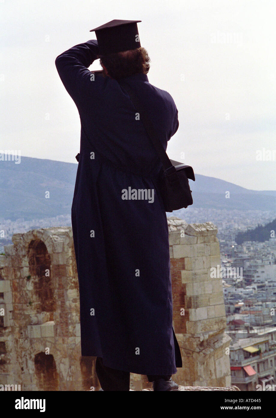 Greek Orthodox priest taking a photograph from the Acropolis Stock ...