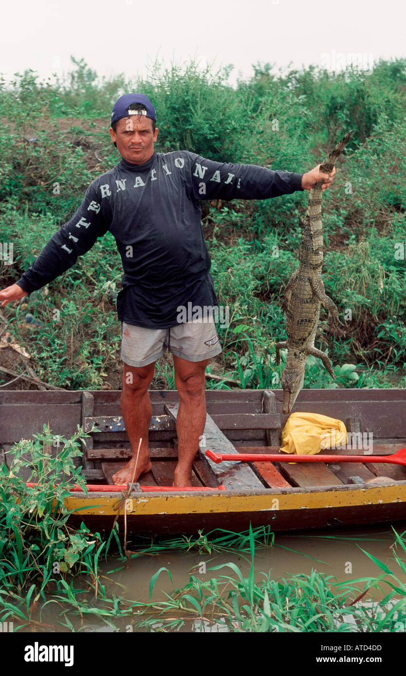 Alligator hunting in the amazon river hi-res stock photography and ...