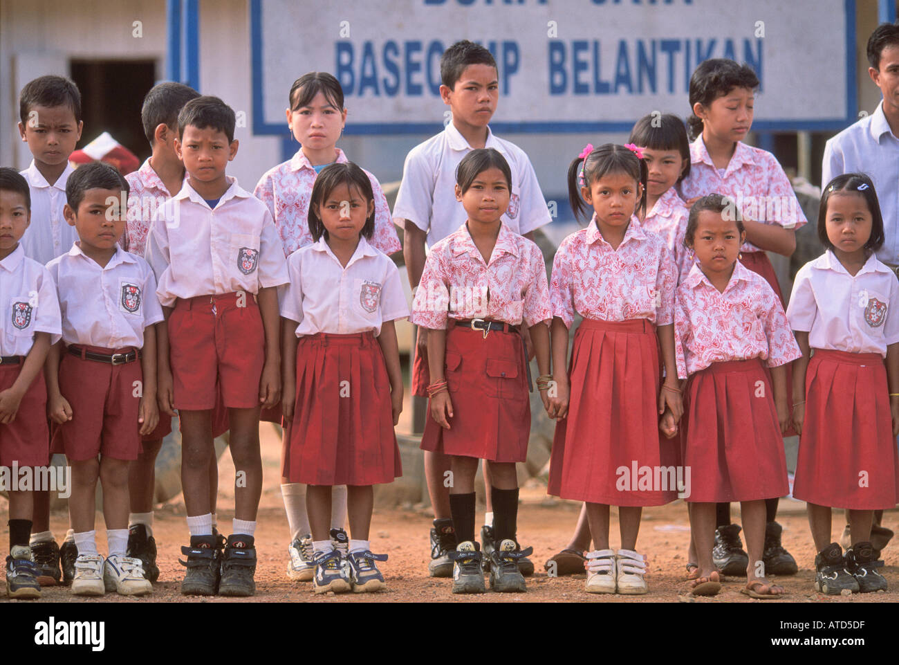 School children attending school on a logging camp in the rainforest of ...