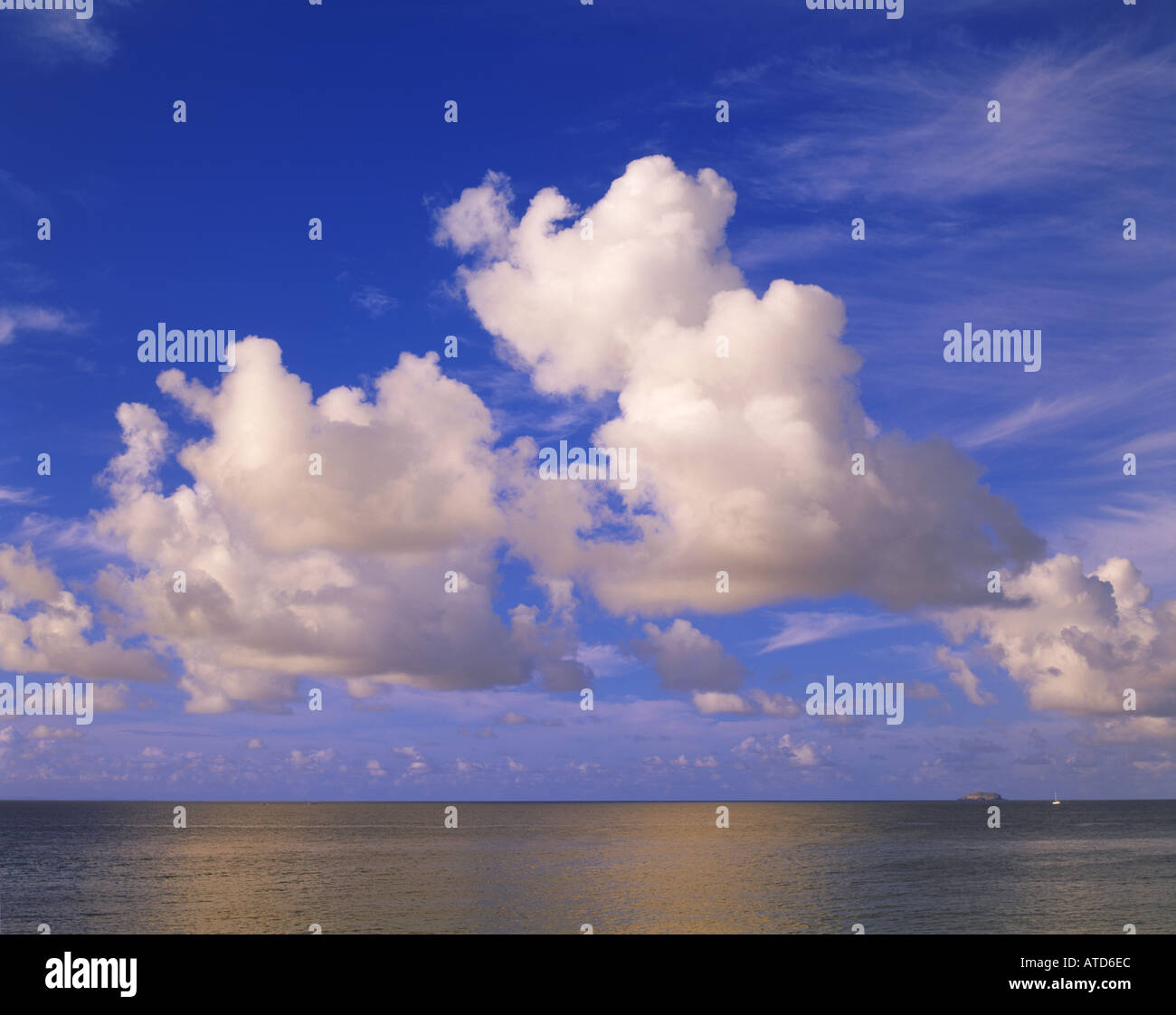 Fluffy white cumulus clouds drift above the ocean Stock Photo - Alamy