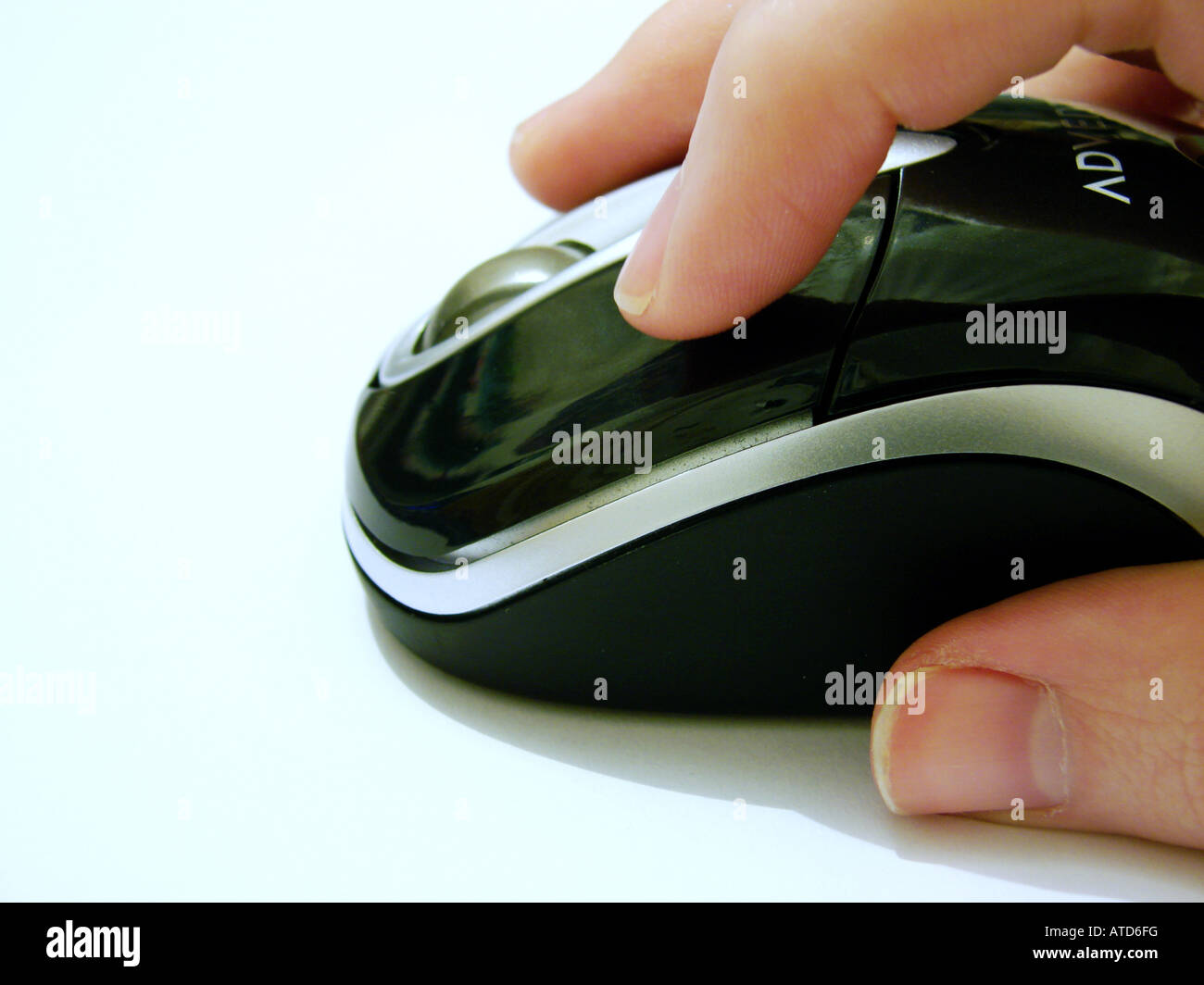 Computer Mouse with a finger about to press down on the button Stock ...