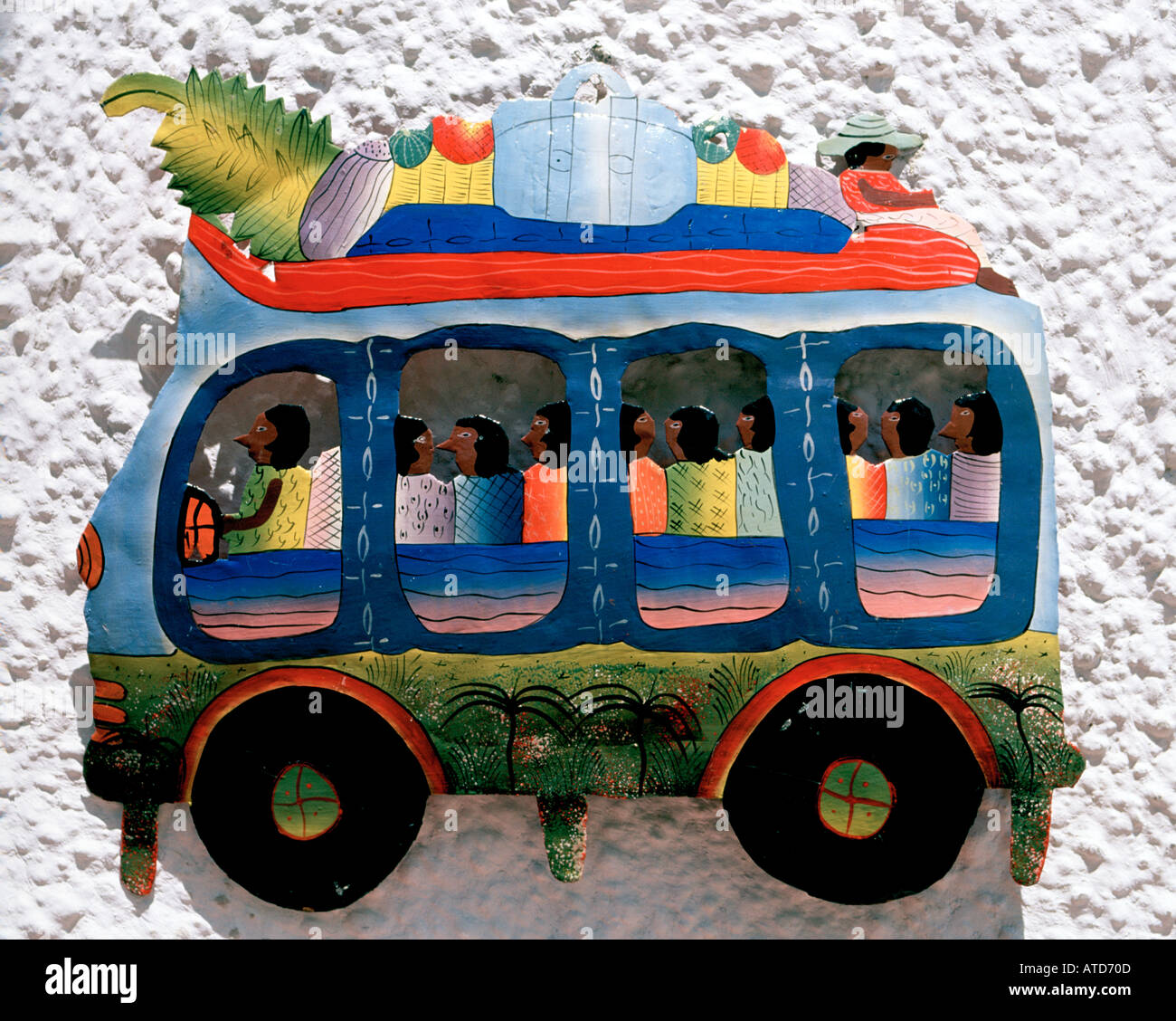 Colorful painted metal folk art in Barbados Stock Photo - Alamy