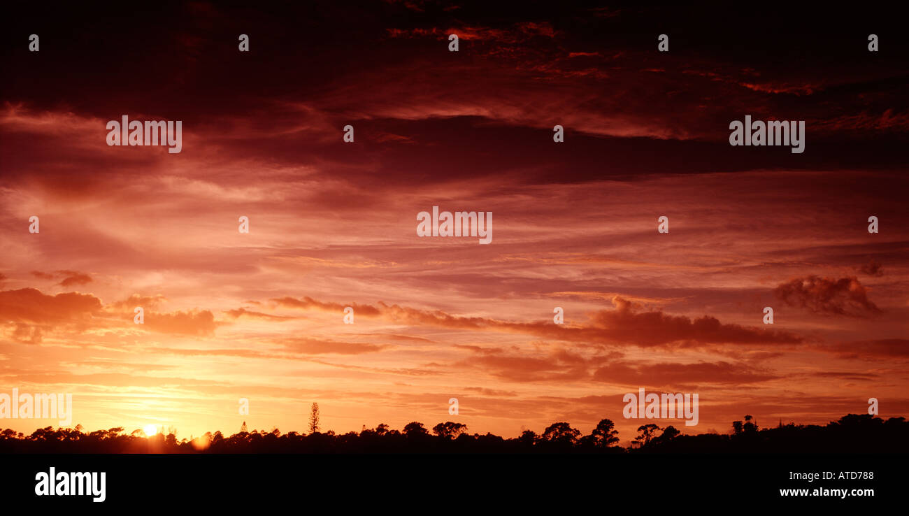 A fiery sunset sky full of clouds Stock Photo - Alamy