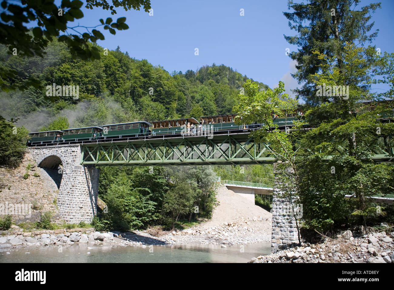 Railway bridge with steam engine and trailer Stock Photo - Alamy