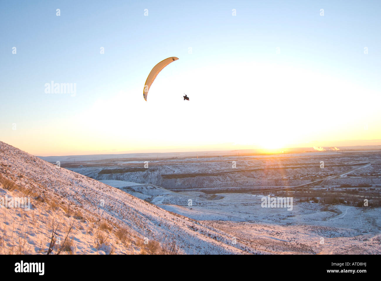 Paragliding on a beautiful day at sunset Stock Photo - Alamy