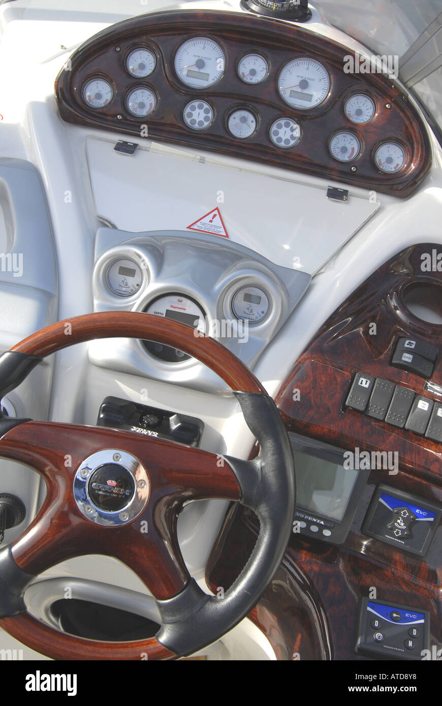 Power boat yacht wood control pannel and steering wheel in port of ...
