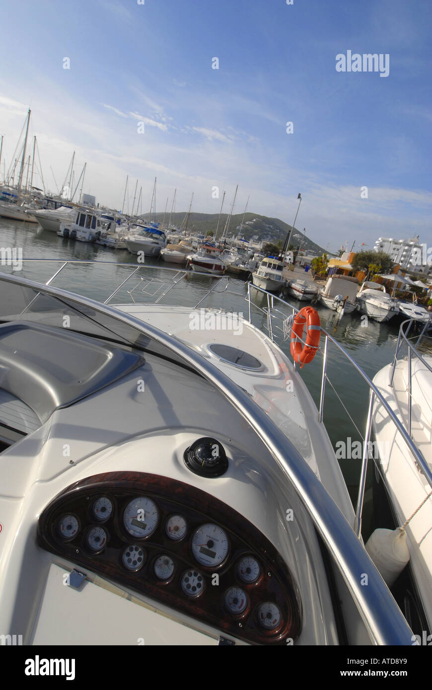 View of Power boat yacht wood control pannel and steering wheel in port ...