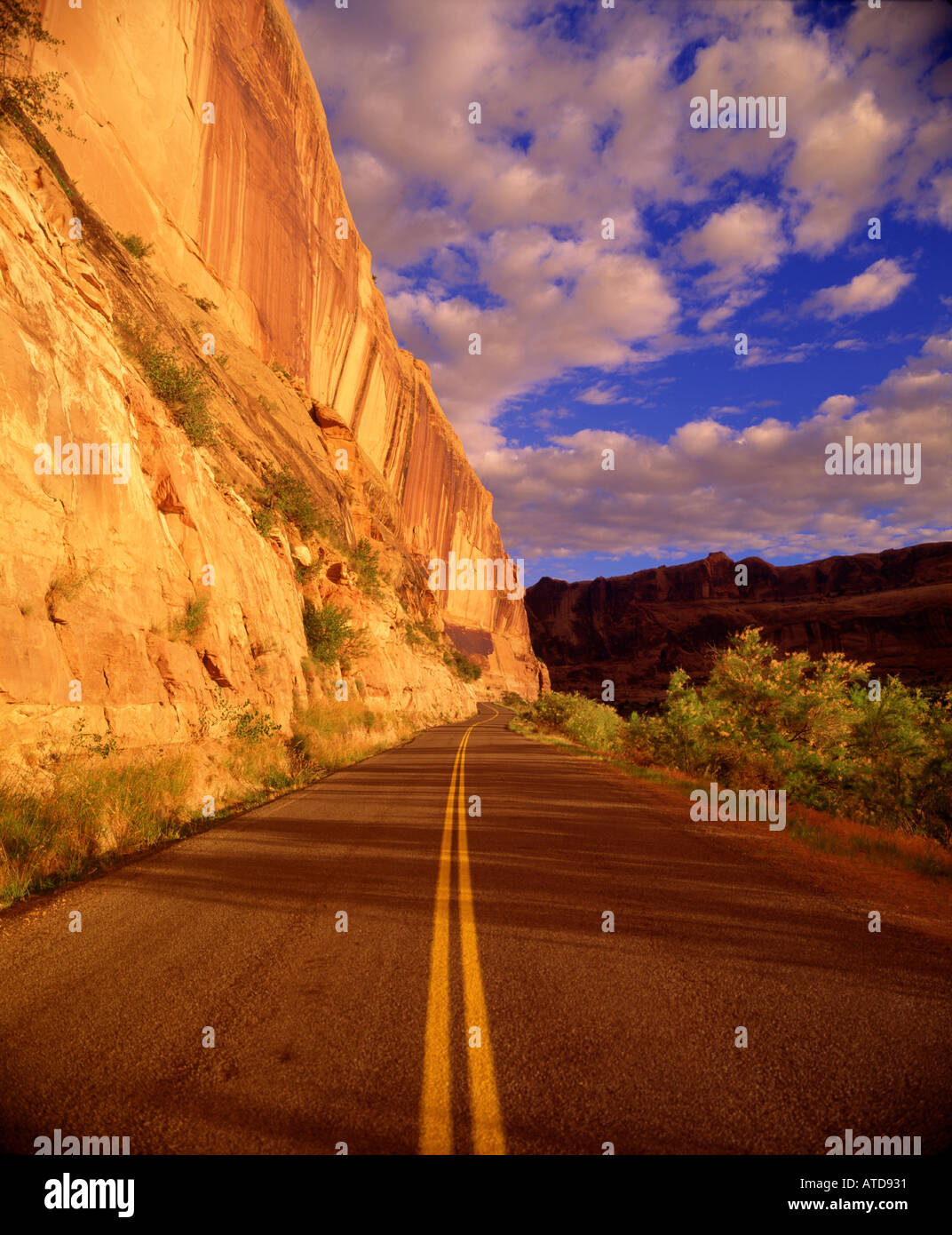 Route 313 in Utah near Arches National Park with a rock face on one ...