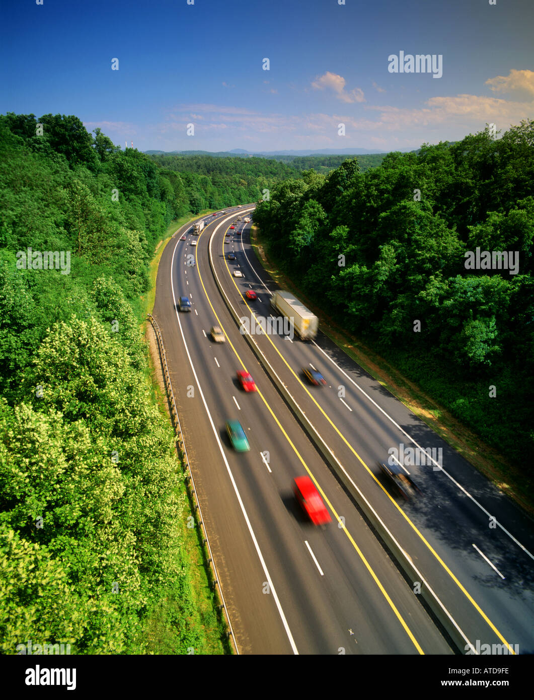 Aerial view of a tree lined highway with light traffic in Asheville ...
