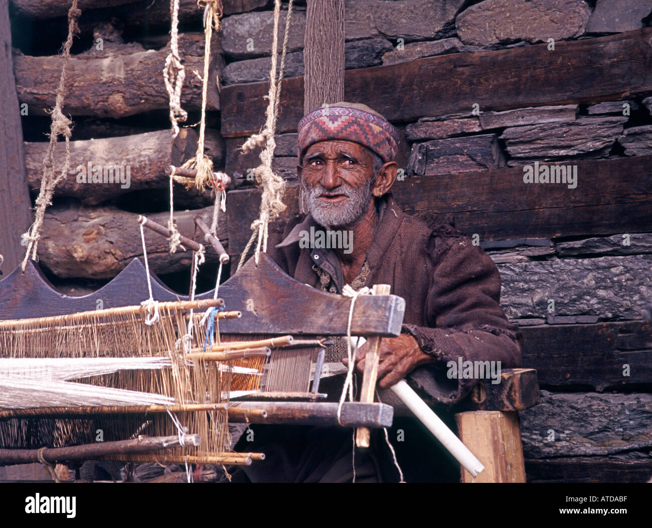 Man weaving on loom Malana village Himachal Pradesh India Stock Photo ...