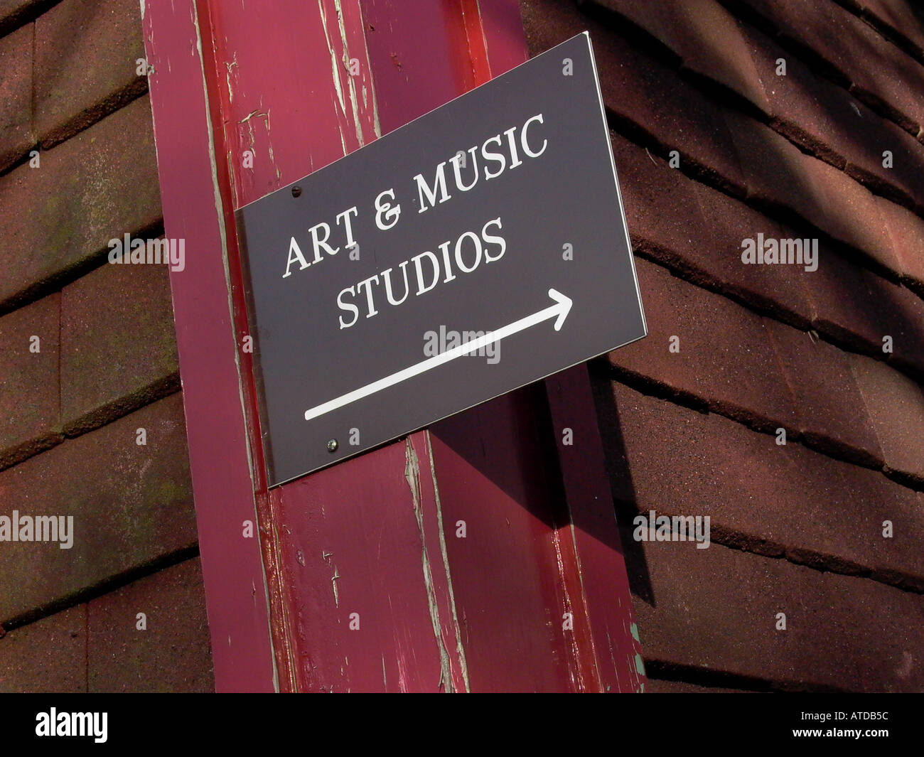 Sign saying Art and Music Studios with an arrow pointing to the right ...