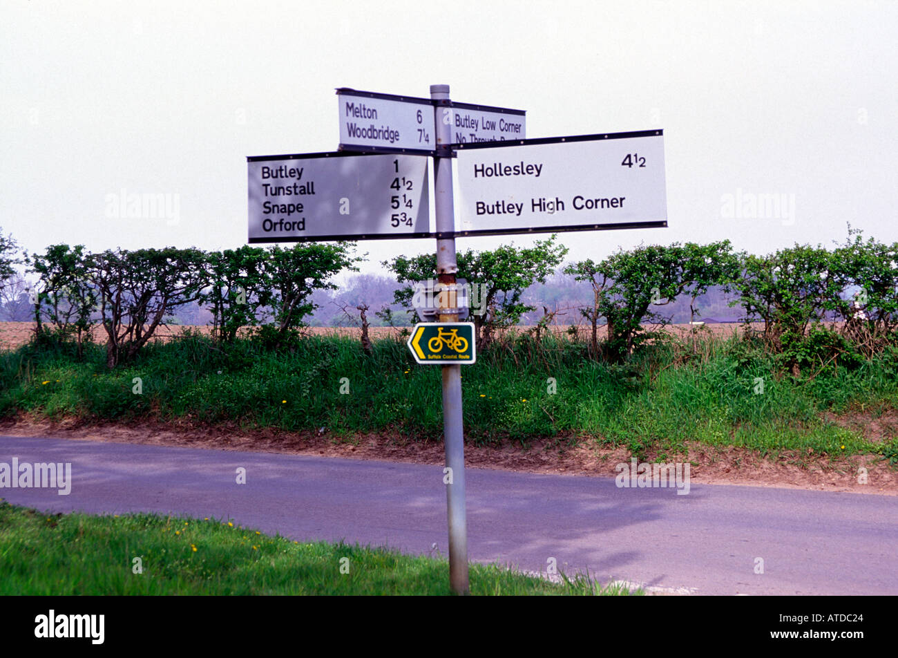 Signpost and country road Suffolk England Stock Photo - Alamy