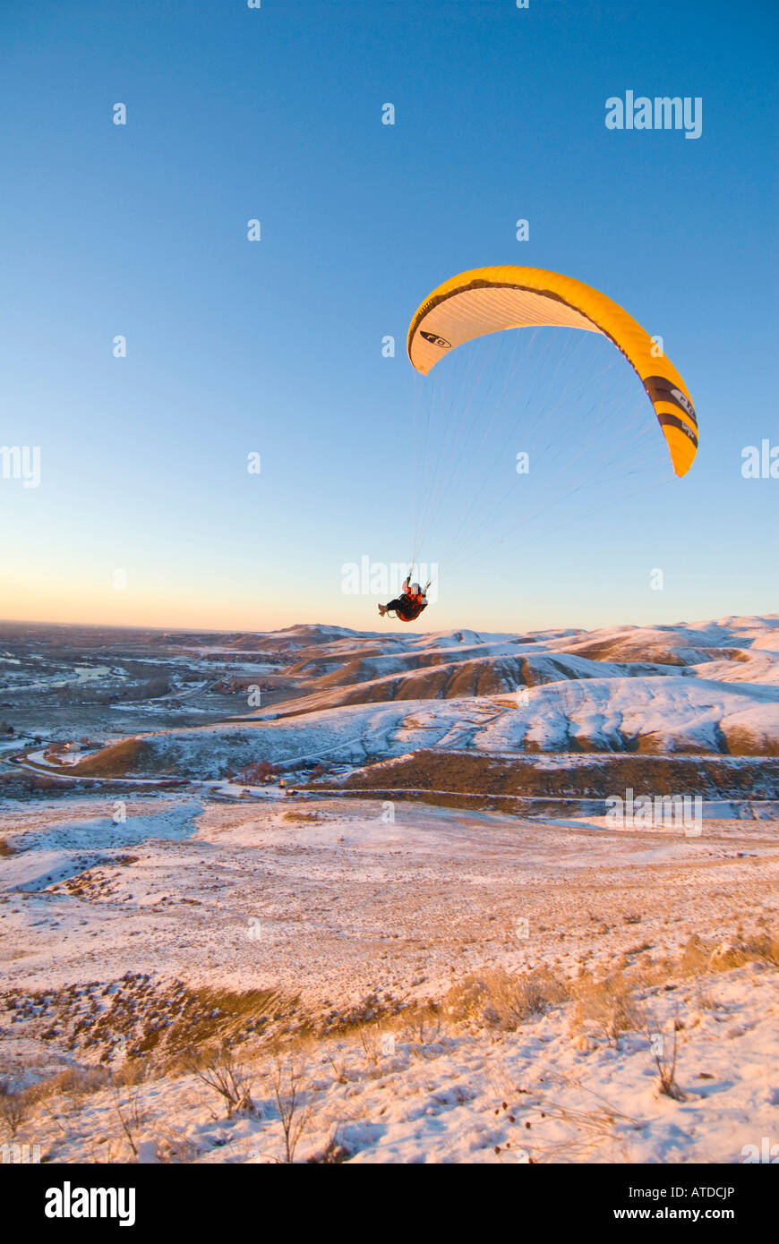 Paragliding on a beautiful day at sunset Stock Photo - Alamy