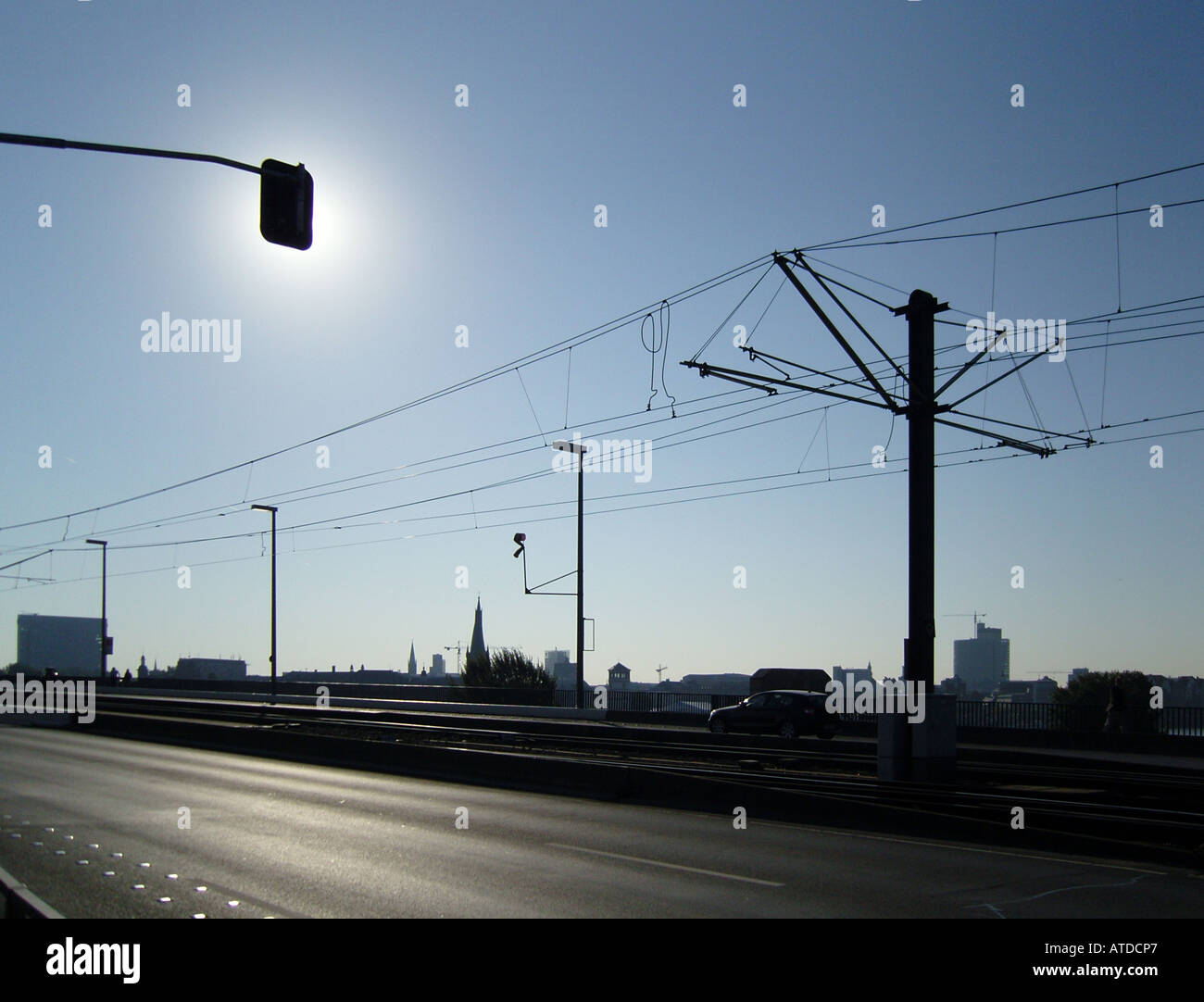 Overhead cables in backlight Stock Photo - Alamy