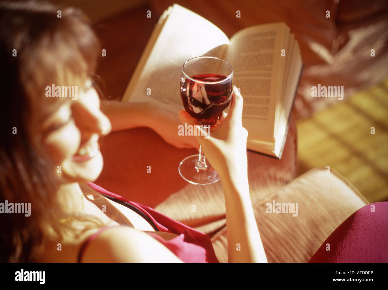 woman drinking wine reading book Stock Photo - Alamy