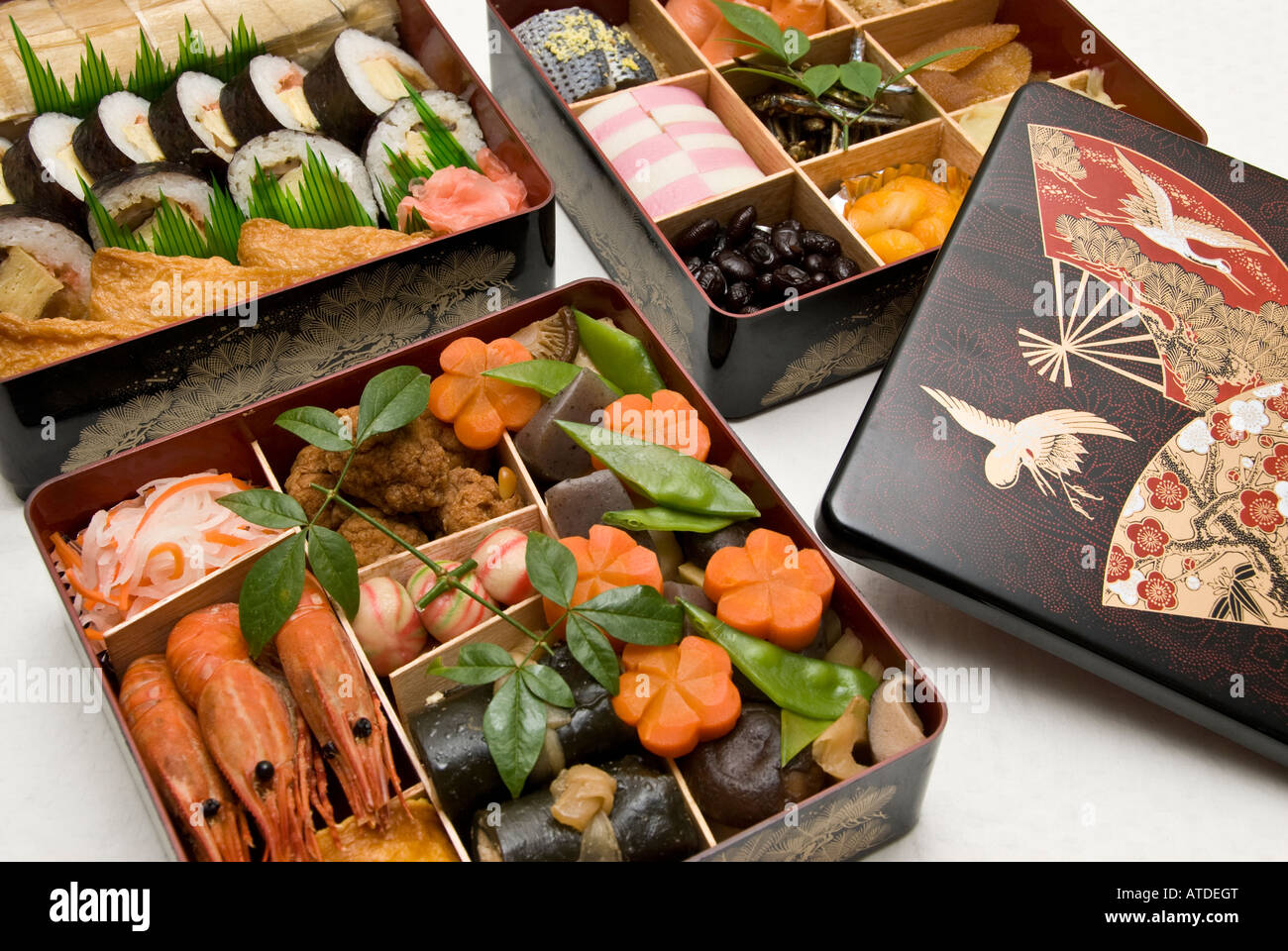 Three-tiered lacquered box called jubako, containing traditional ...