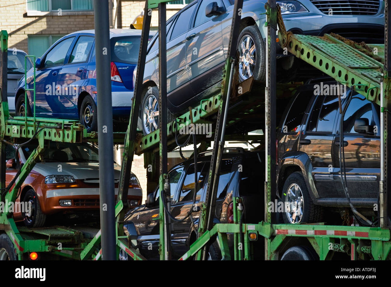 Cars on a transport truck close up Stock Photo - Alamy