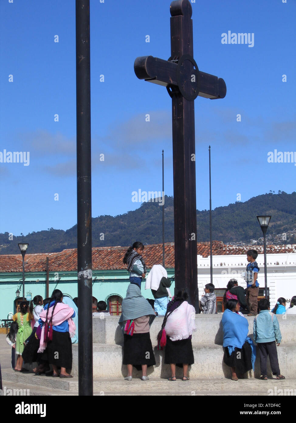 indiginous mayan indian people gather round the cross outside the ...