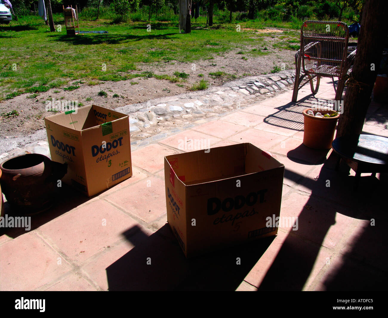 cardboard boxes on porch of country house spain Stock Photo - Alamy