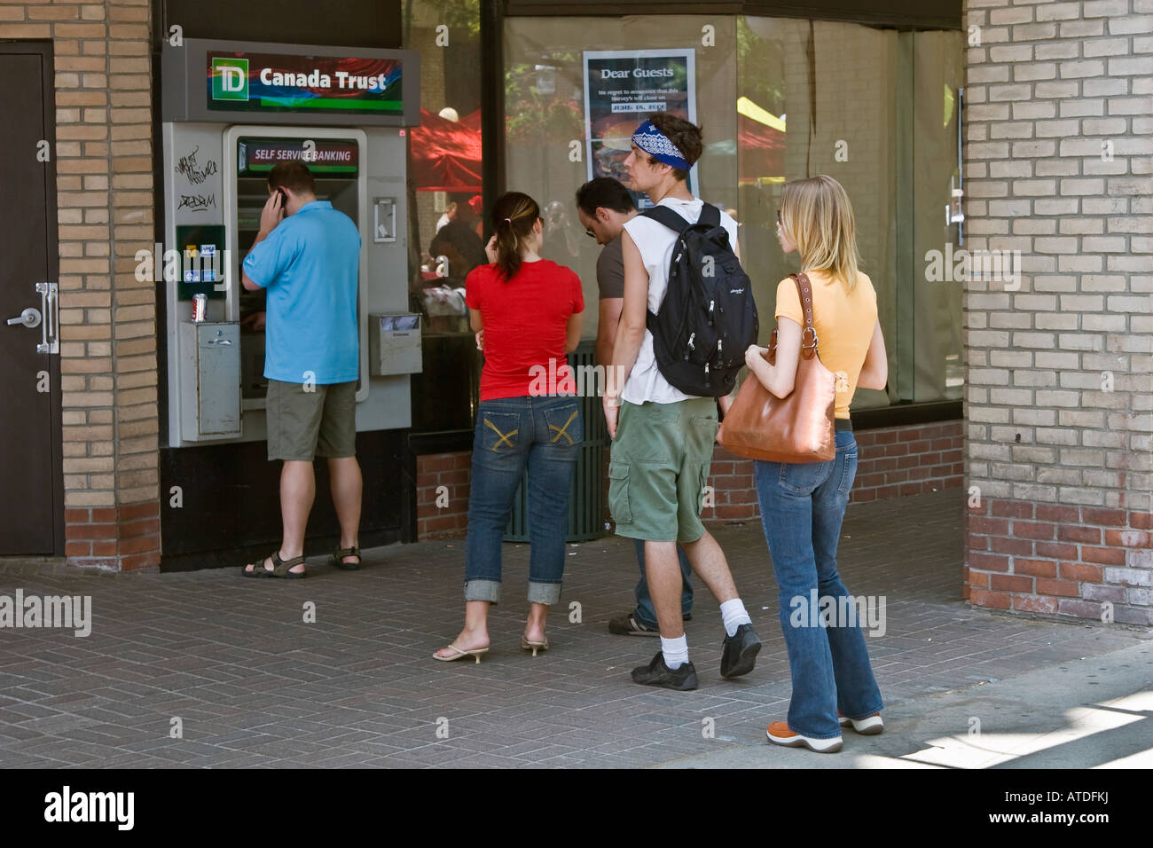 People line up at ATM Toronto Canada Stock Photo - Alamy