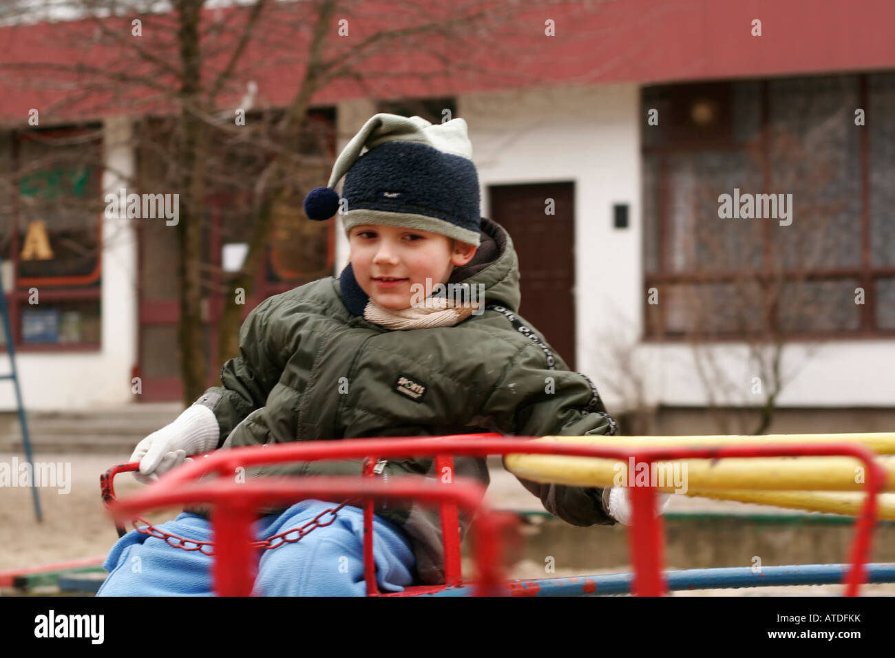 Young boy on merry-go-round, Children Playing on Merry-go-round in park ...