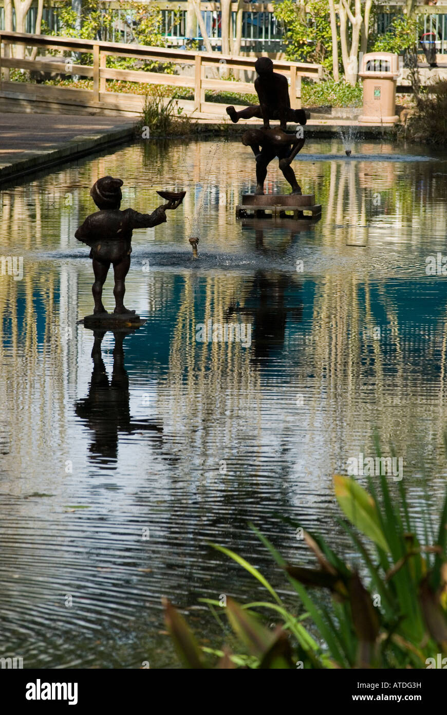 Two statues in the Reflection Pool at the Houston Zoo Texas USA Stock ...