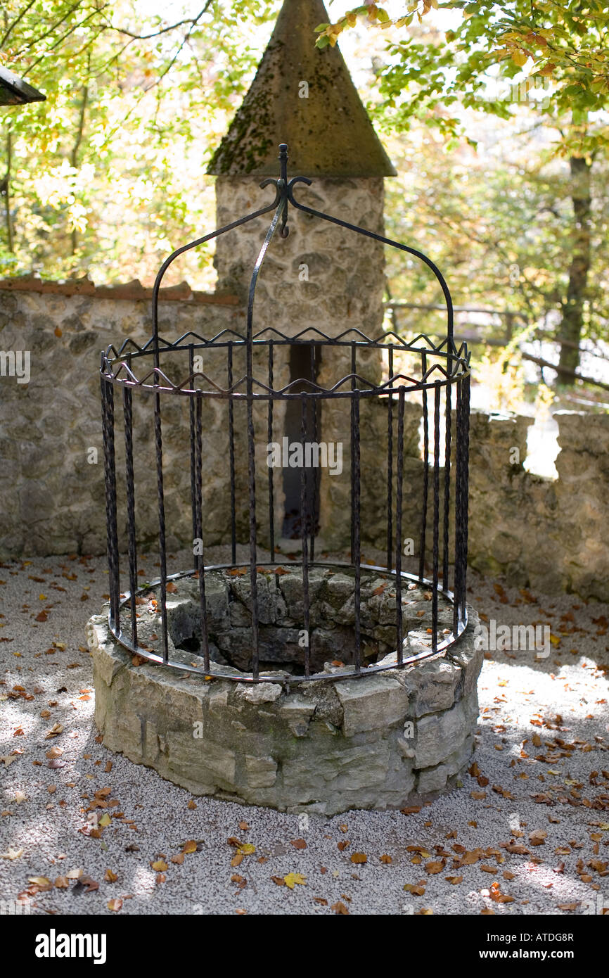 Well with iron edge Stock Photo - Alamy
