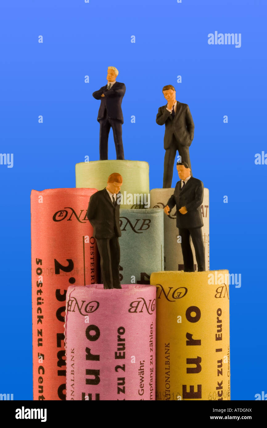 Figures on Euro coin piles Stock Photo - Alamy