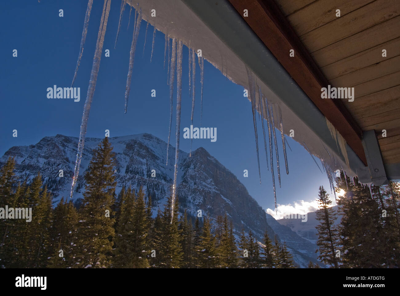 winter icicles frozen ice spikes hang roof mountains trees background ...