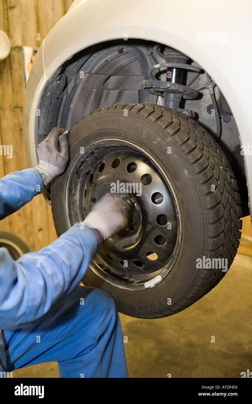 Winter tire assembly in a workshop Stock Photo - Alamy