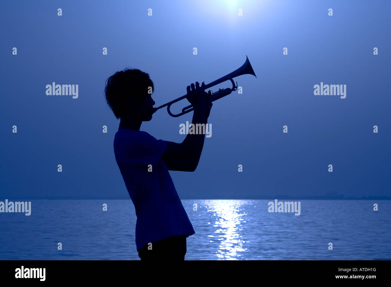 Man blowing into trumpet hi-res stock photography and images - Alamy