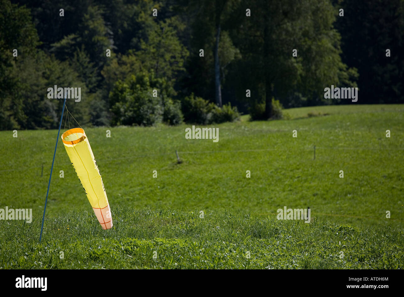 Paraglider and windsock Stock Photo - Alamy
