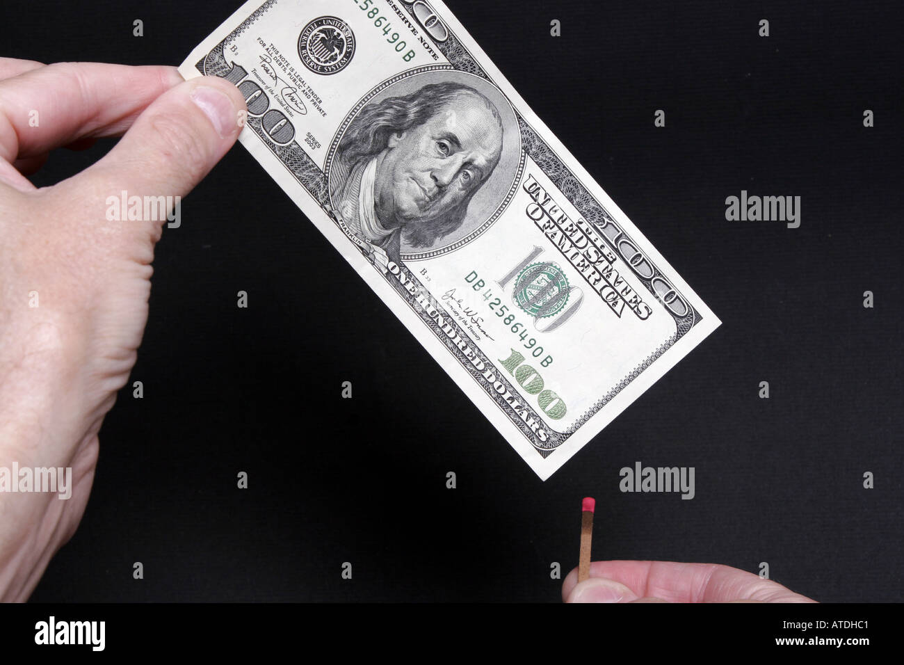 Burning one hundred dollars hi-res stock photography and images - Alamy