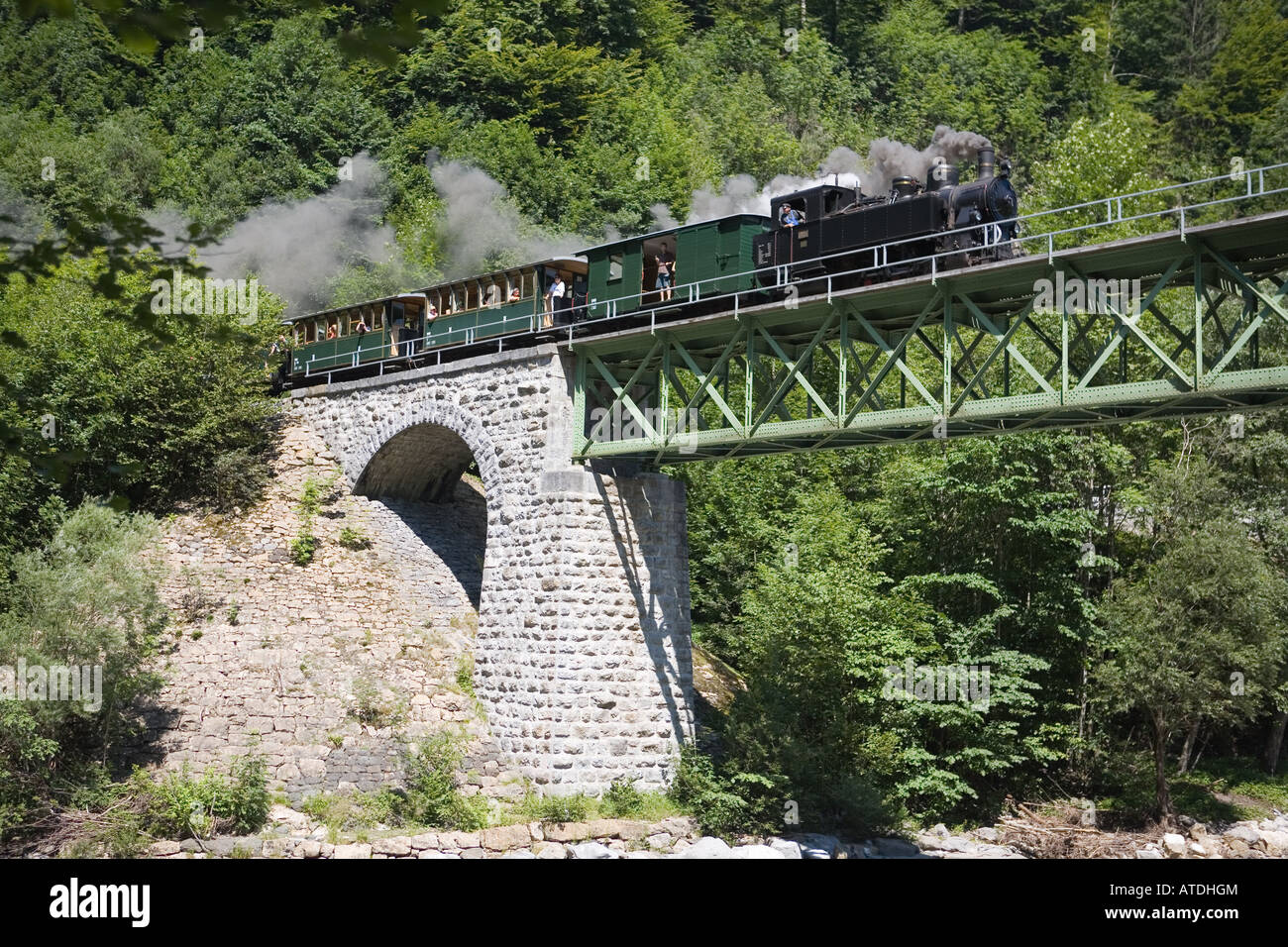 Railway bridge with steam engine and trailer Stock Photo - Alamy