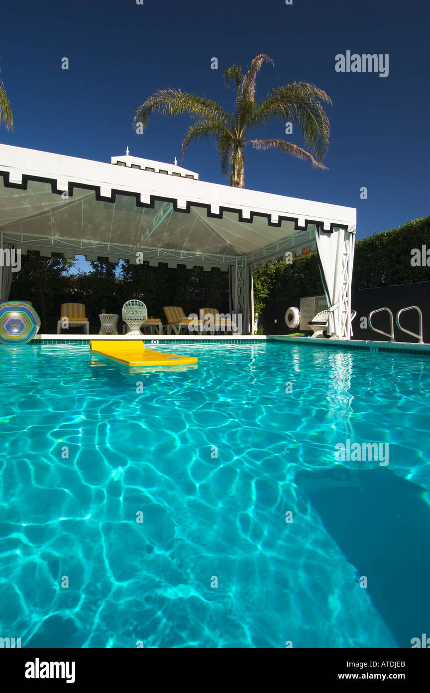 Yellow float in swimming pool Stock Photo - Alamy