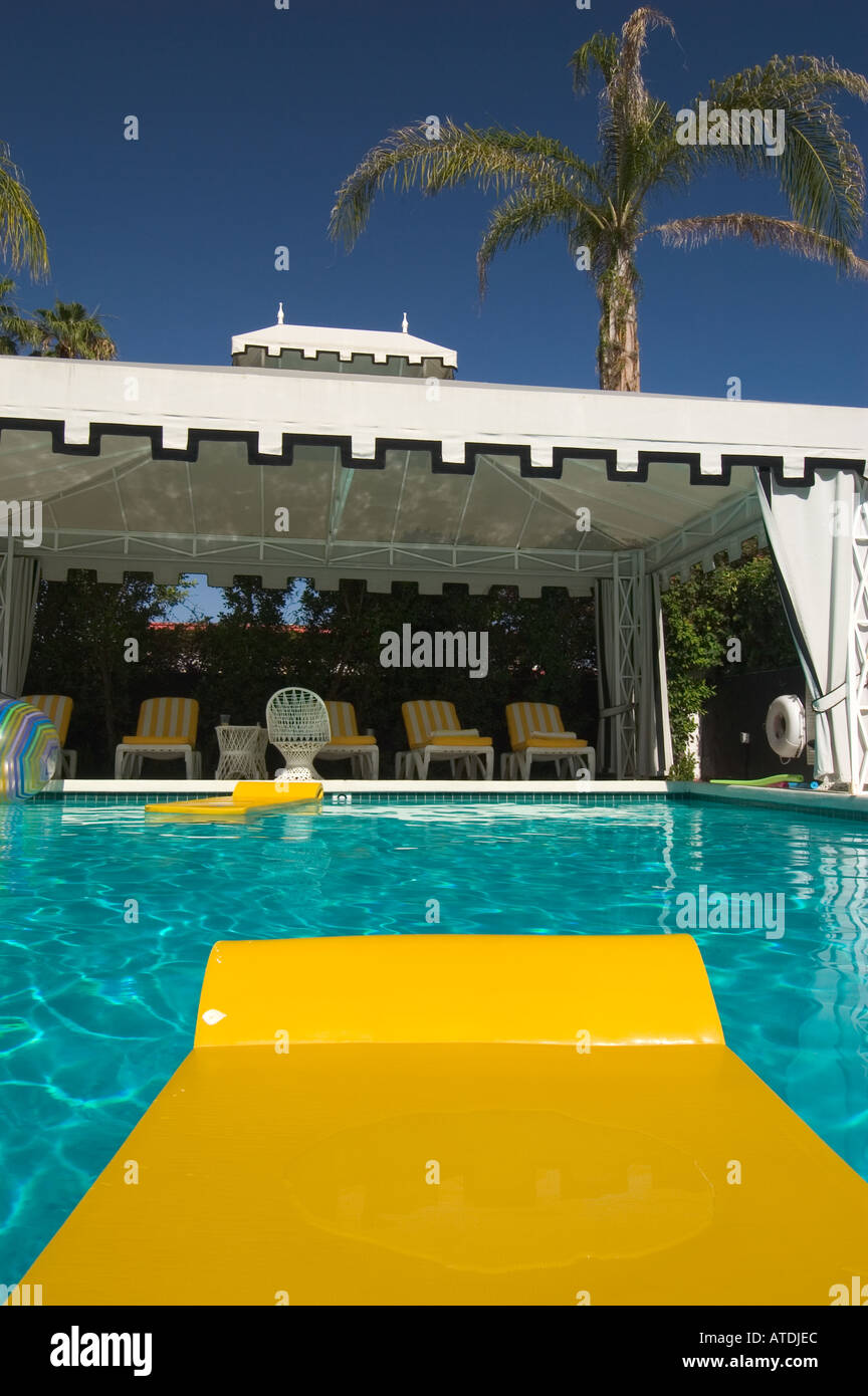 Yellow float in swimming pool Stock Photo - Alamy