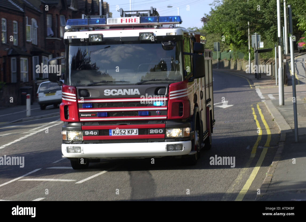 Fire engine speeding through the streets of Luton Bedfordshire UK ...
