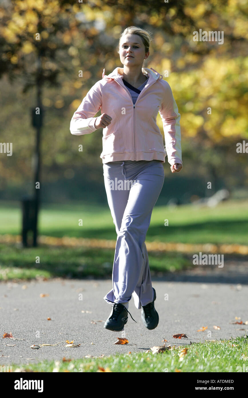 Young blonde women running in the park hi-res stock photography and ...
