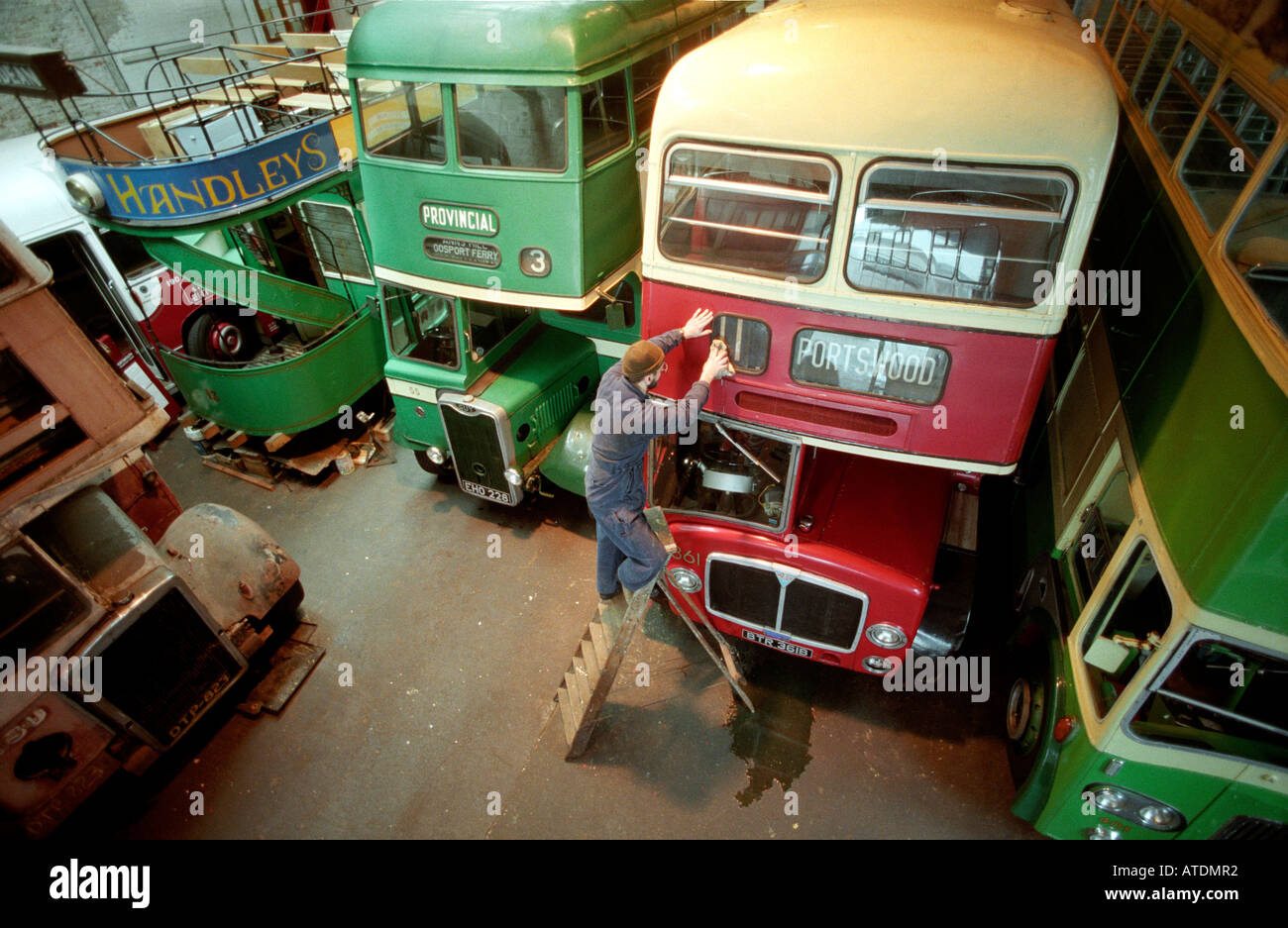 A maintainance engineer restoring an old AEC double decker bus at ...