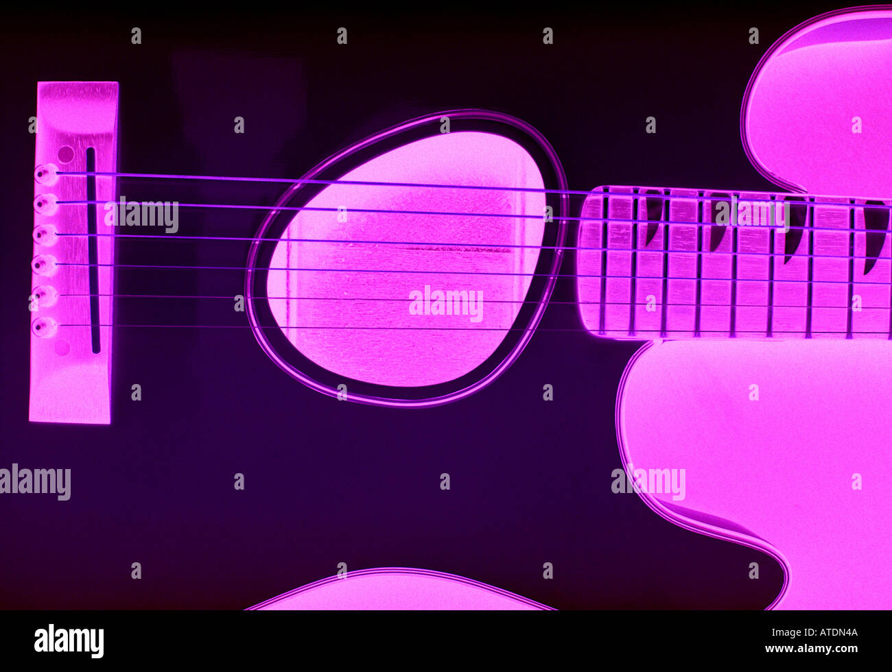 GUITAR AS A NEGATIVE PINK BACKGROUND Stock Photo - Alamy
