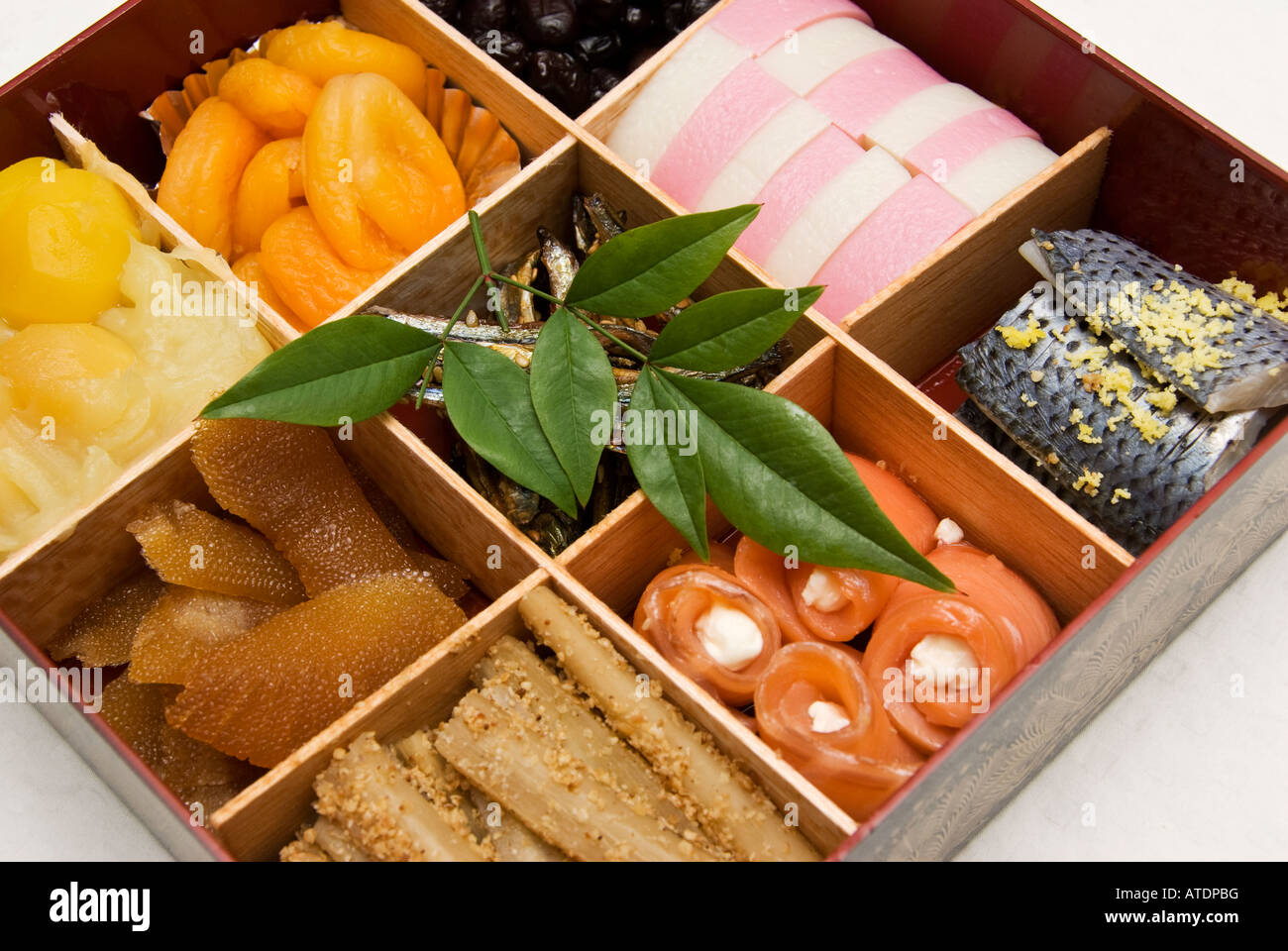 Three-tiered lacquered box called jubako, containing traditional ...