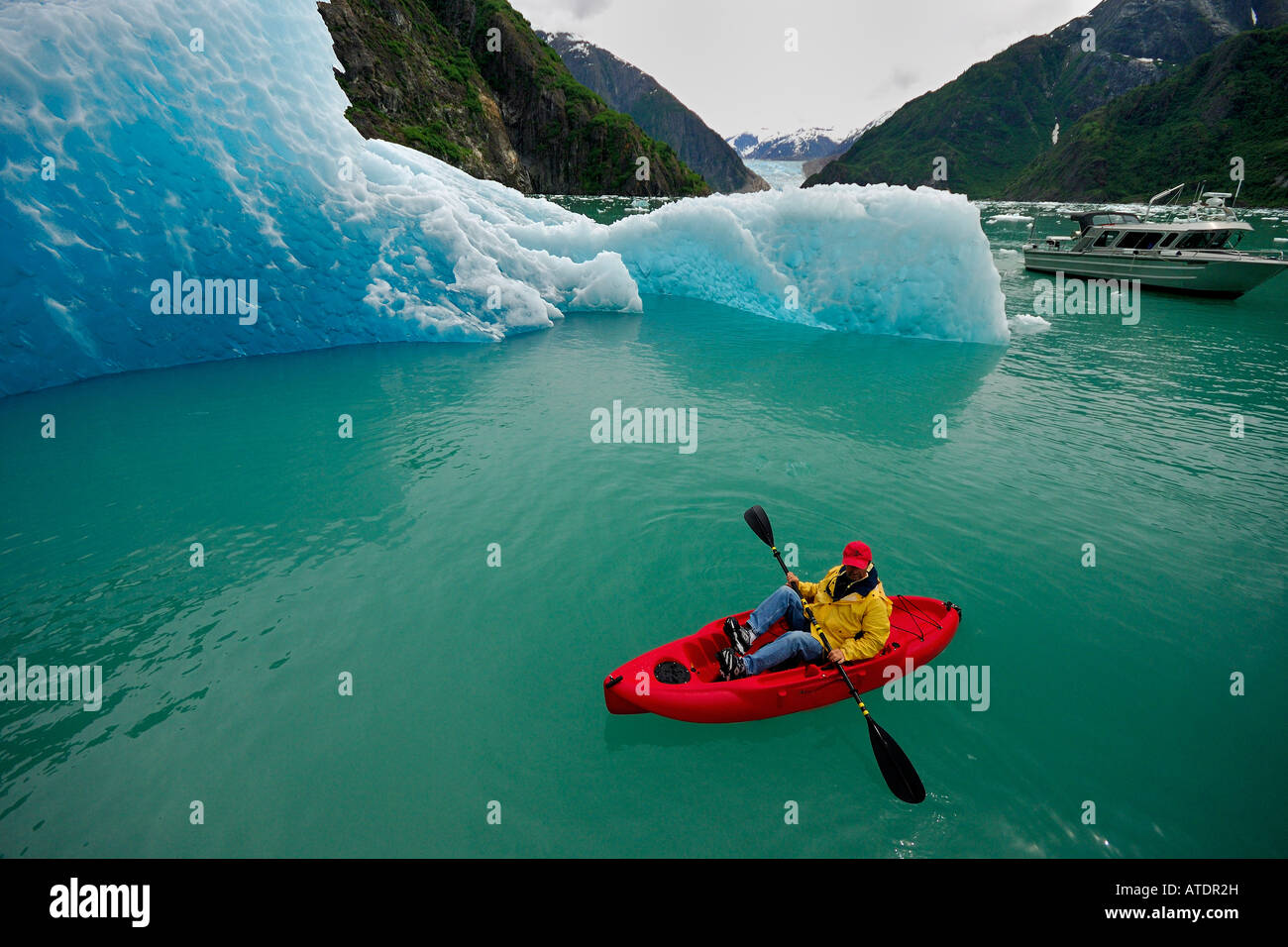 Exploring an iceberg by sea kayak in Tracy Arm Alaska Pacific Ocean ...