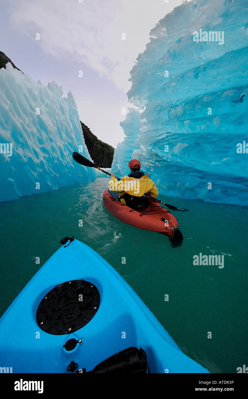 Exploring an iceberg by sea kayak in Tracy Arm Alaska Pacific Ocean ...