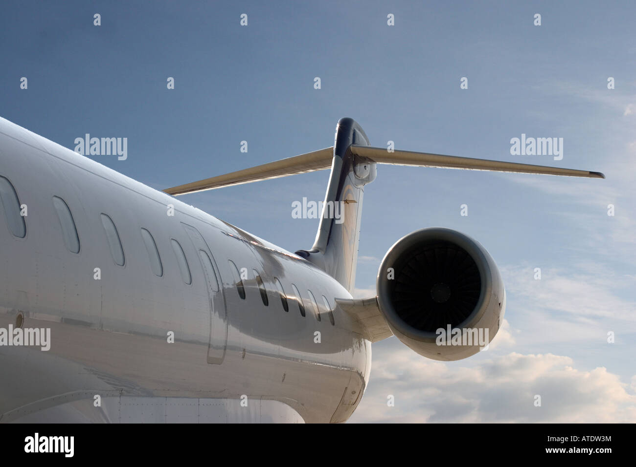 Engine and tail of a jet Stock Photo - Alamy