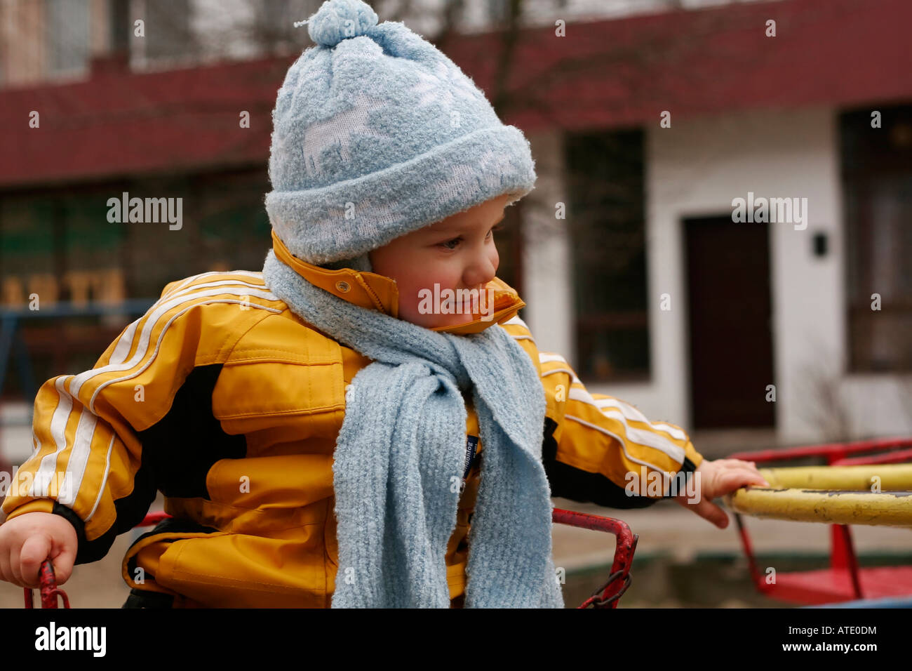 Children Playing on Merry-go-round in park Stock Photo - Alamy