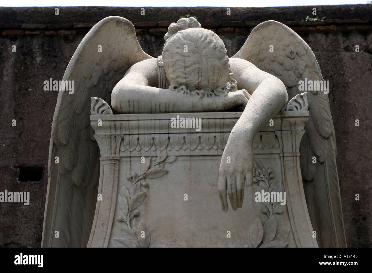 Angel sculpture on a grave at the Protestant cemetery in Rome Italy ...