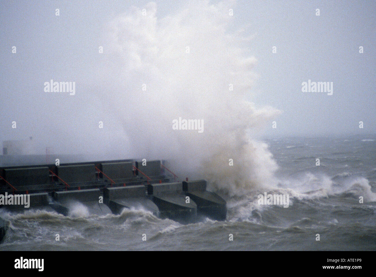 Breaking Against Breakwater High Resolution Stock Photography and ...