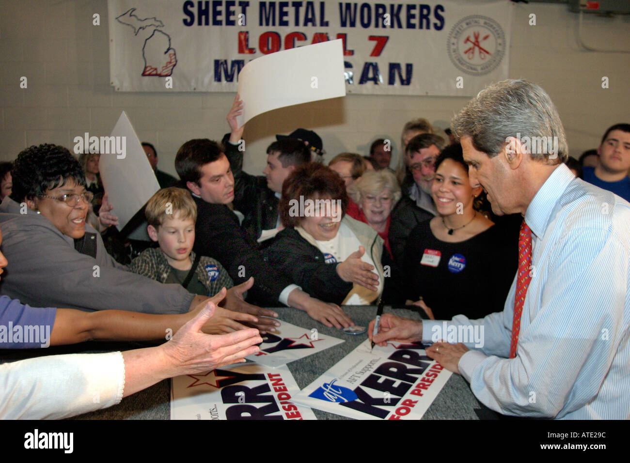Sen John Kerry signs autographs during his campaign for president of ...