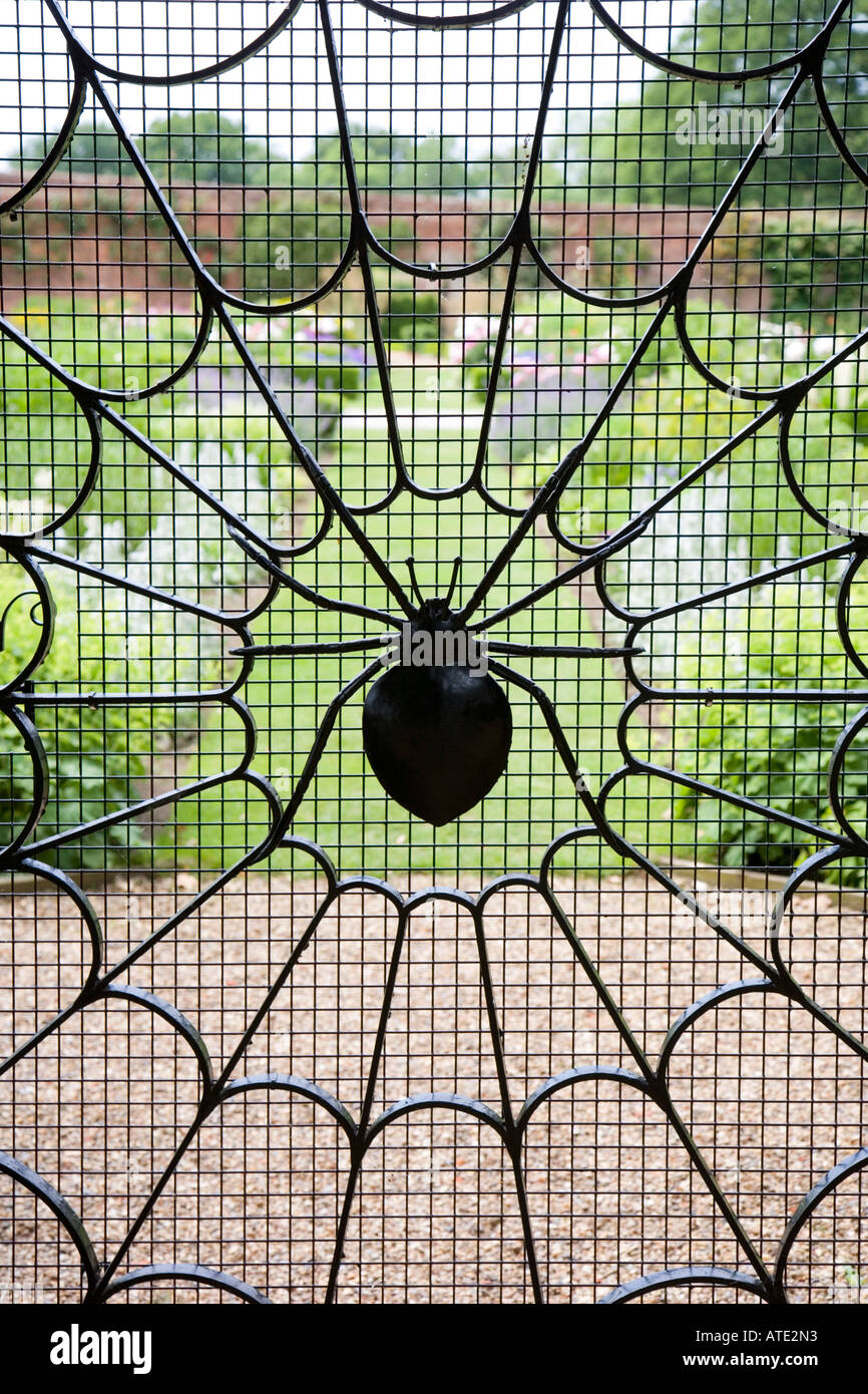 Wrought Iron Gate with Spider Web Design Stock Photo - Alamy